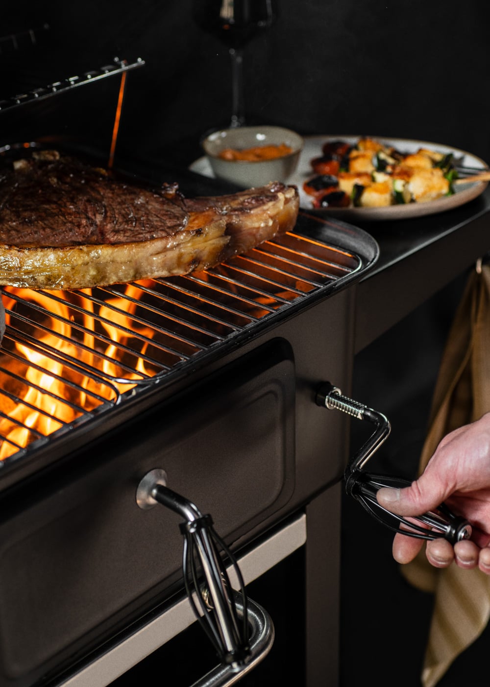 Charcoal smoker barbecue with adjustable grate and folding side table ...